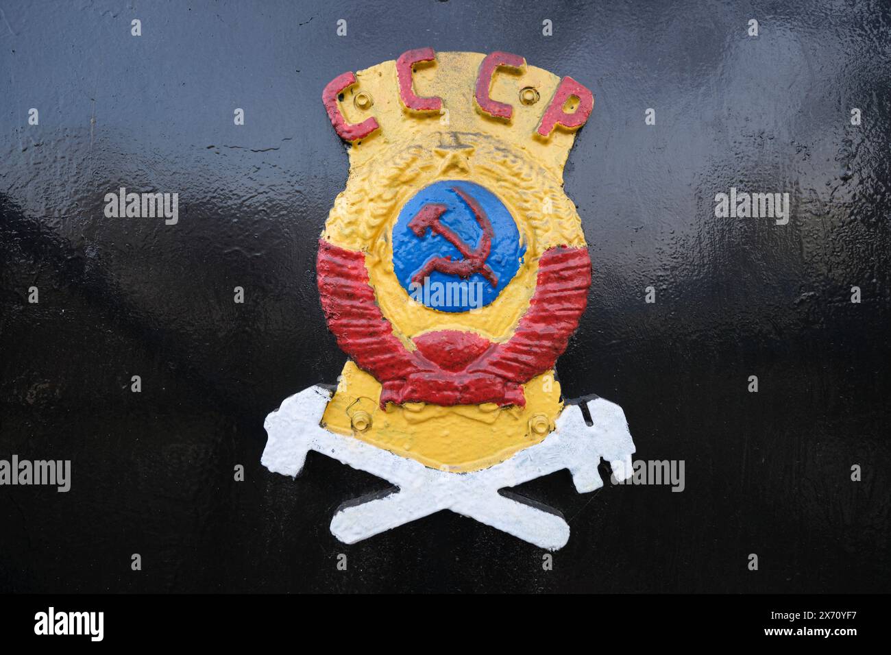Detail of an old Soviet crest, symbol, medallion with hammer and wrench ...