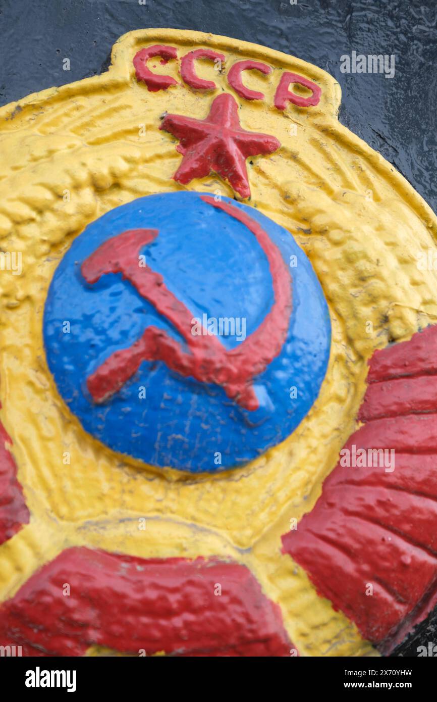 Detail of an old Soviet crest, symbol, medallion with hammer and sickle ...