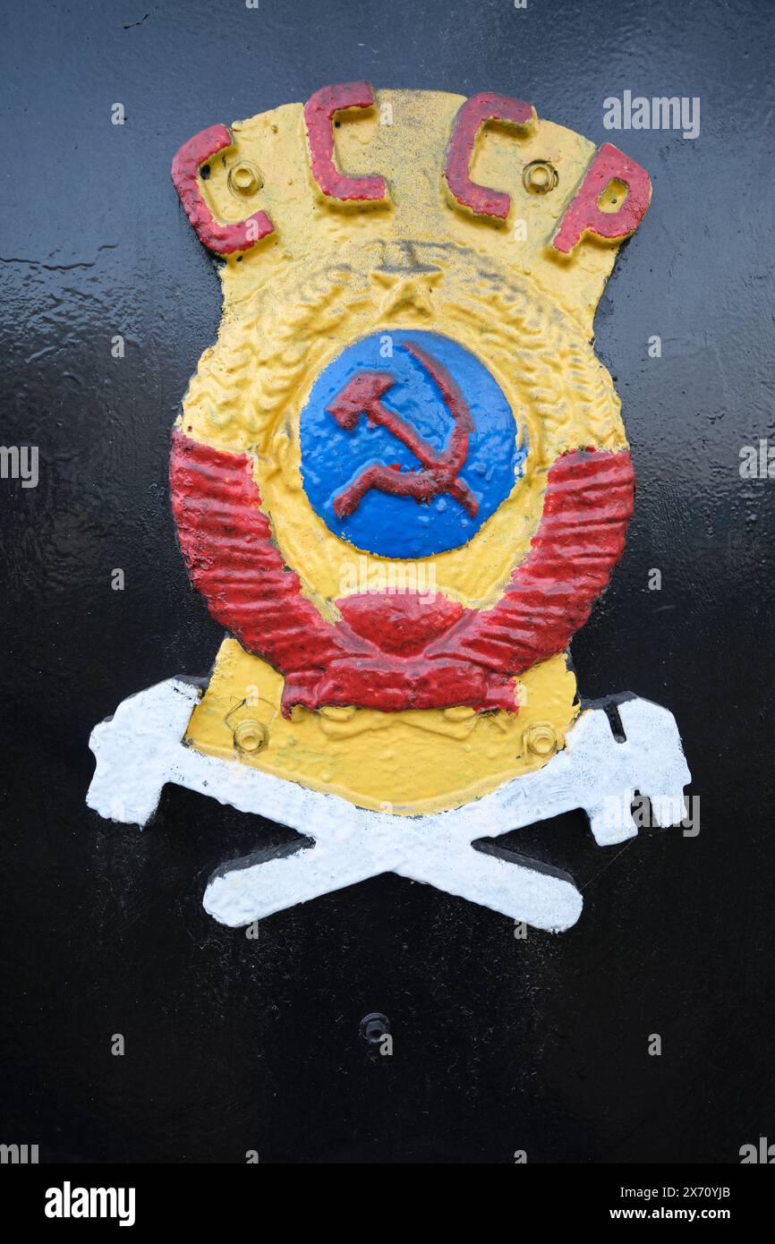 Detail of an old Soviet crest, symbol, medallion with hammer and wrench ...