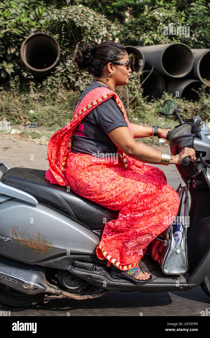 indian woman driving with scooter outdoors Stock Photo - Alamy