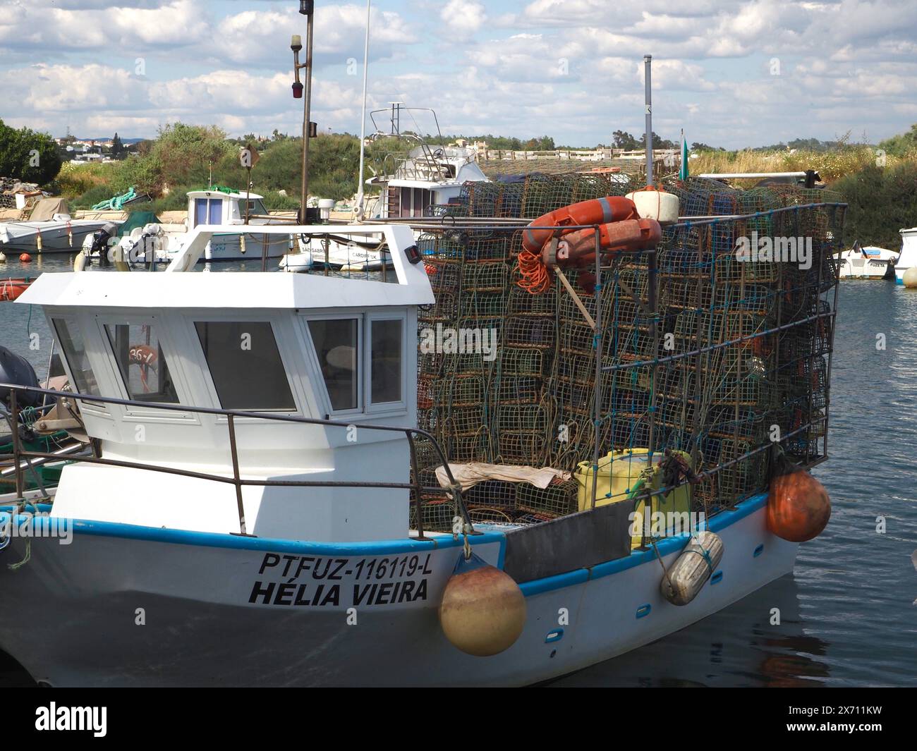 Fishing boat Hélia Vieira stacked with fishing cages and gear in the ...