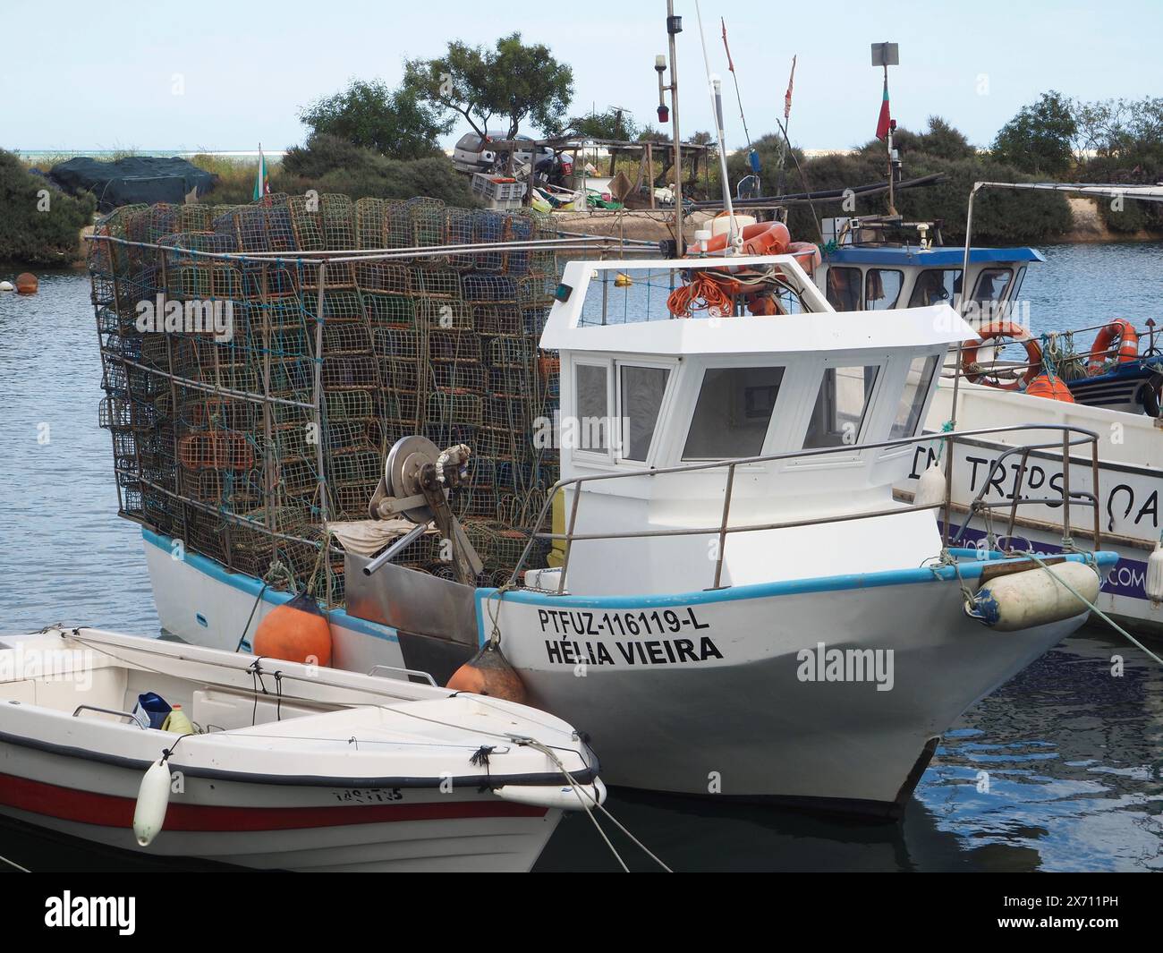 Fishing boat Hélia Vieira stacked with fishing cages and gear in the ...