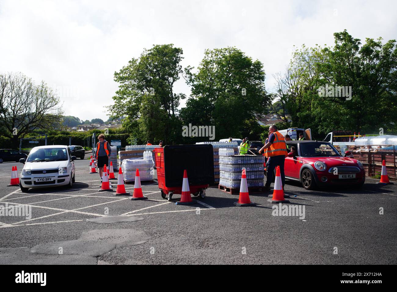 People collecting bottled water at Broadsands Car Park in Paignton ...