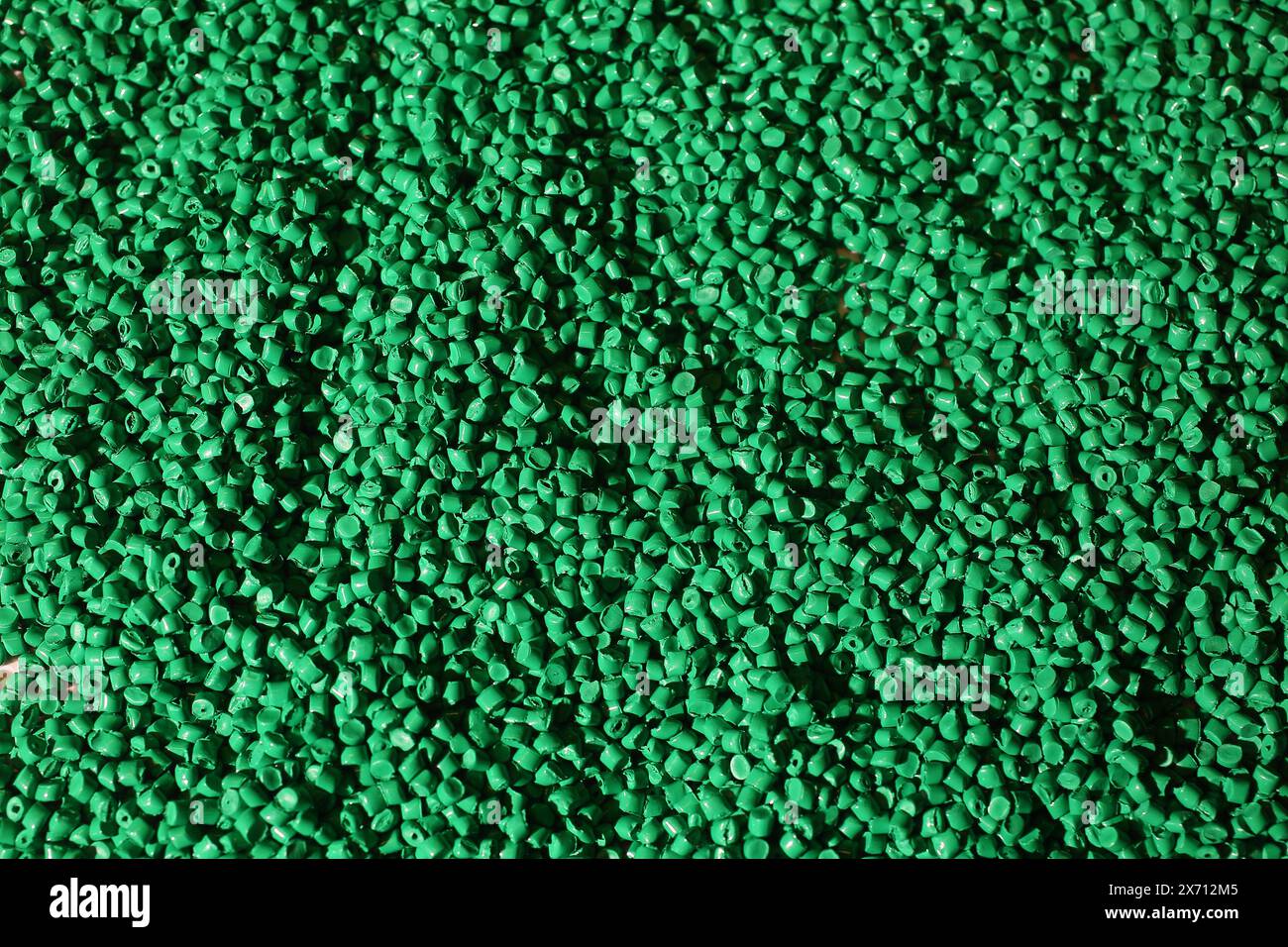 Macro frame of green plastic granules. The polymer composite is poured ...