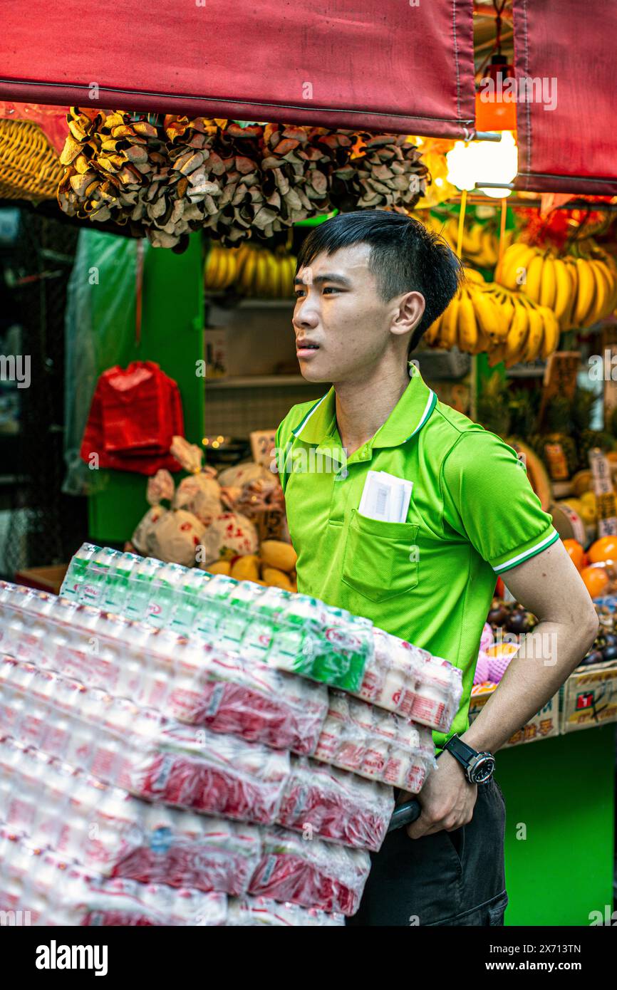 man makes a store delivery in Hong Kong, Asia Stock Photo - Alamy