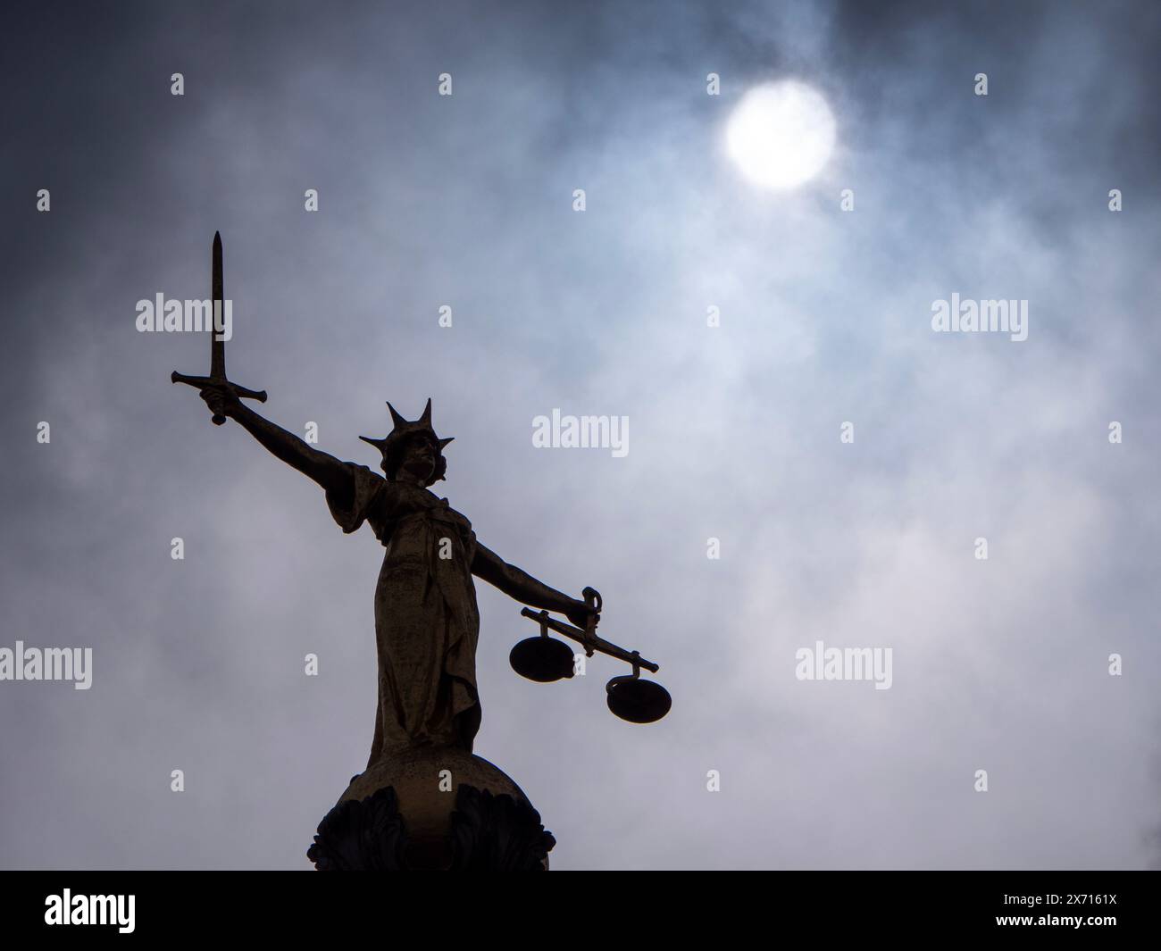 Lady Justice statue holding a sword and the scales of justice on the ...