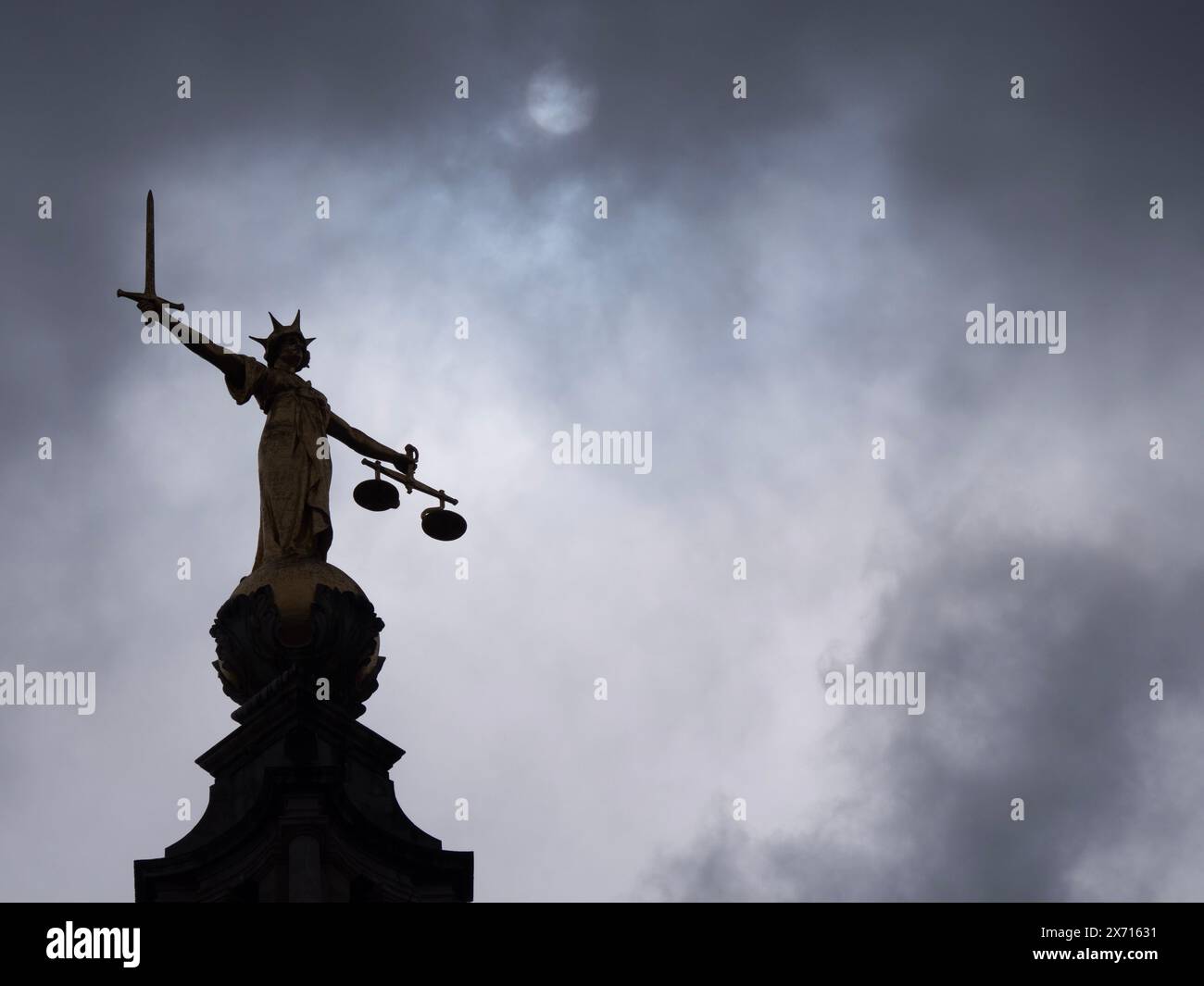 Lady Justice statue holding a sword and the scales of justice on the ...