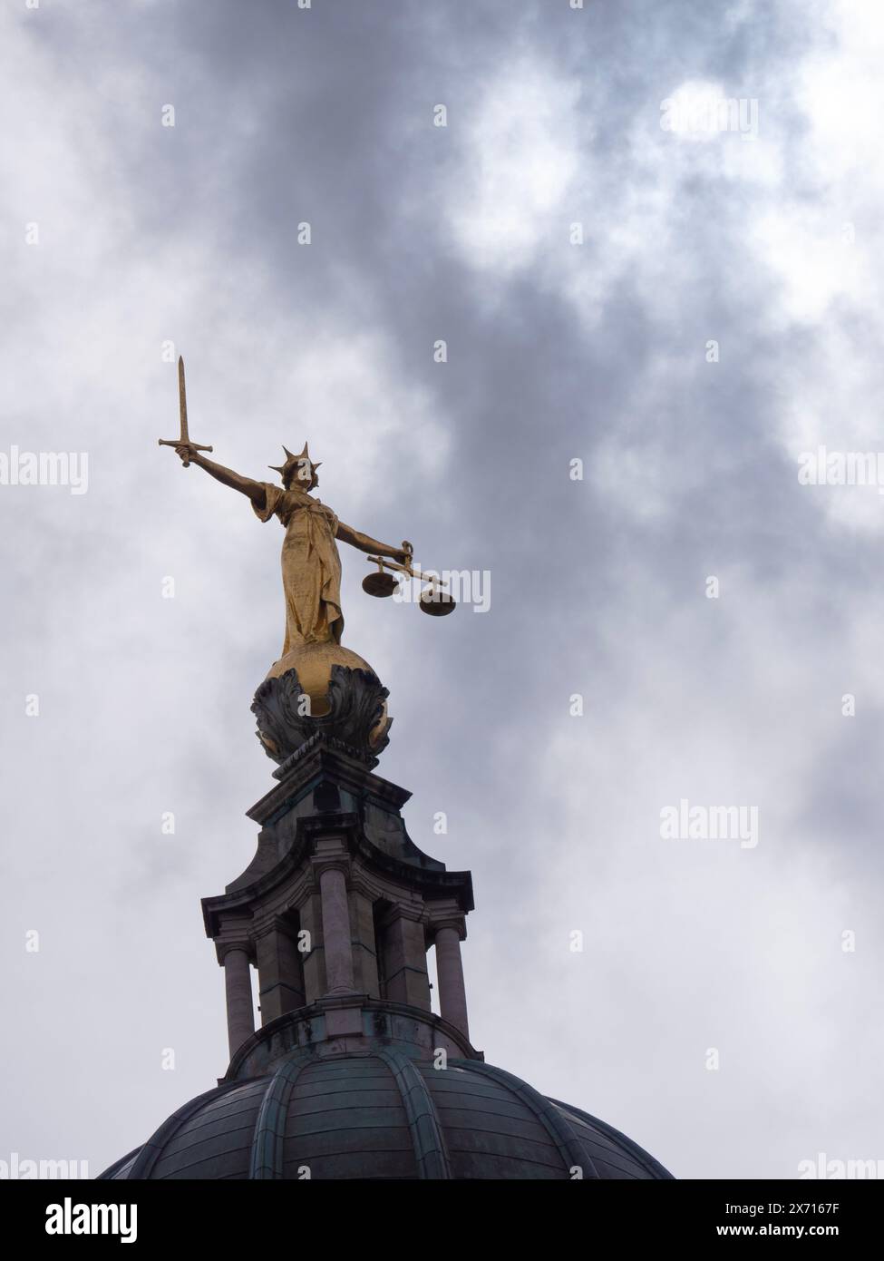 Lady Justice statue holding a sword and the scales of justice on the ...