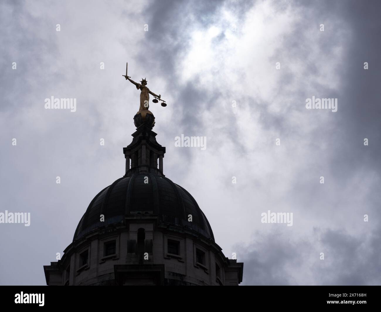 Lady Justice statue holding a sword and the scales of justice on the ...