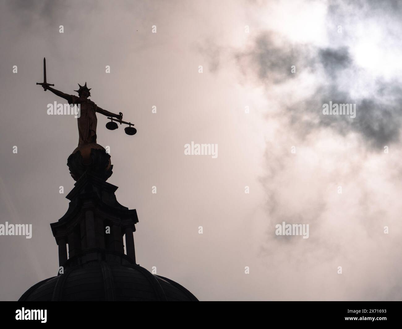 Lady Justice statue holding a sword and the scales of justice on the ...