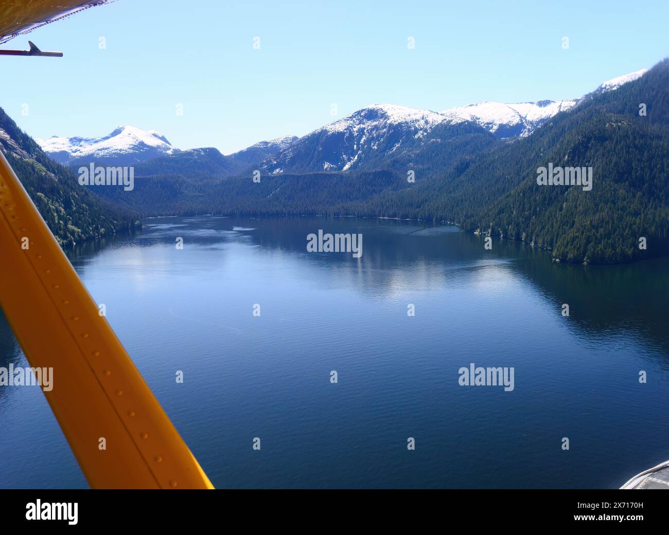 A floatplane landing on the lake of Misty Fjords National Monument ...