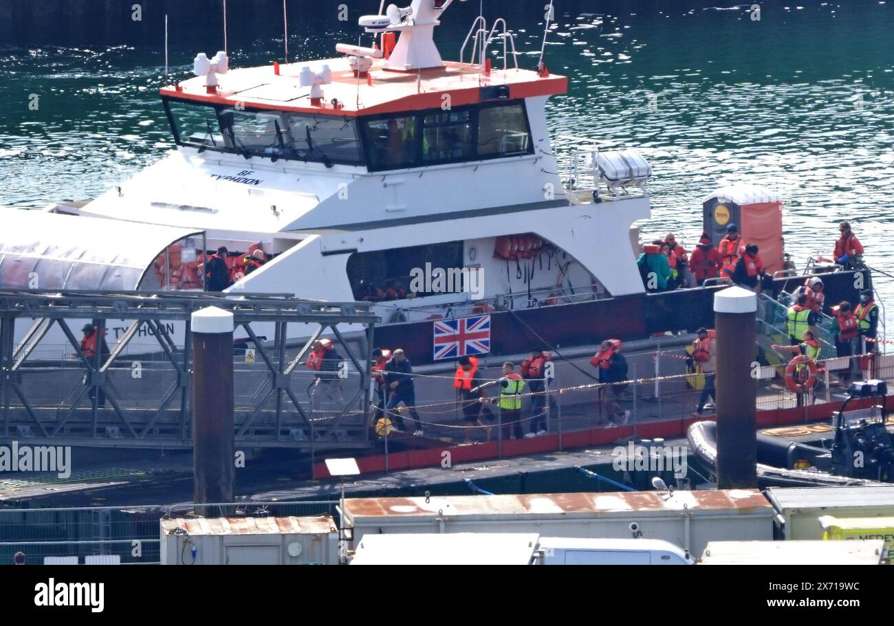 A group of people thought to be migrants are brought in to Dover, Kent ...