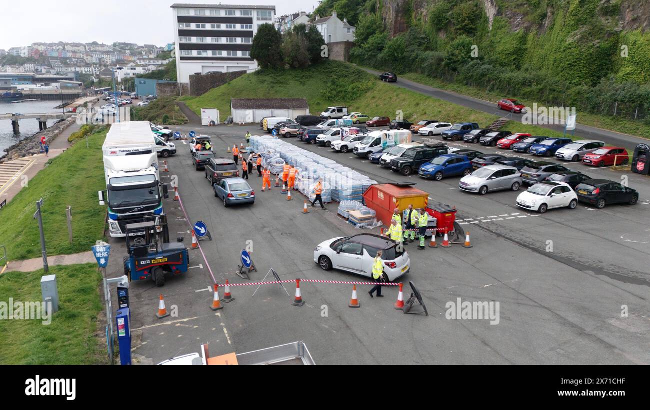A drone view of people collecting bottled water at Freshwater car park ...