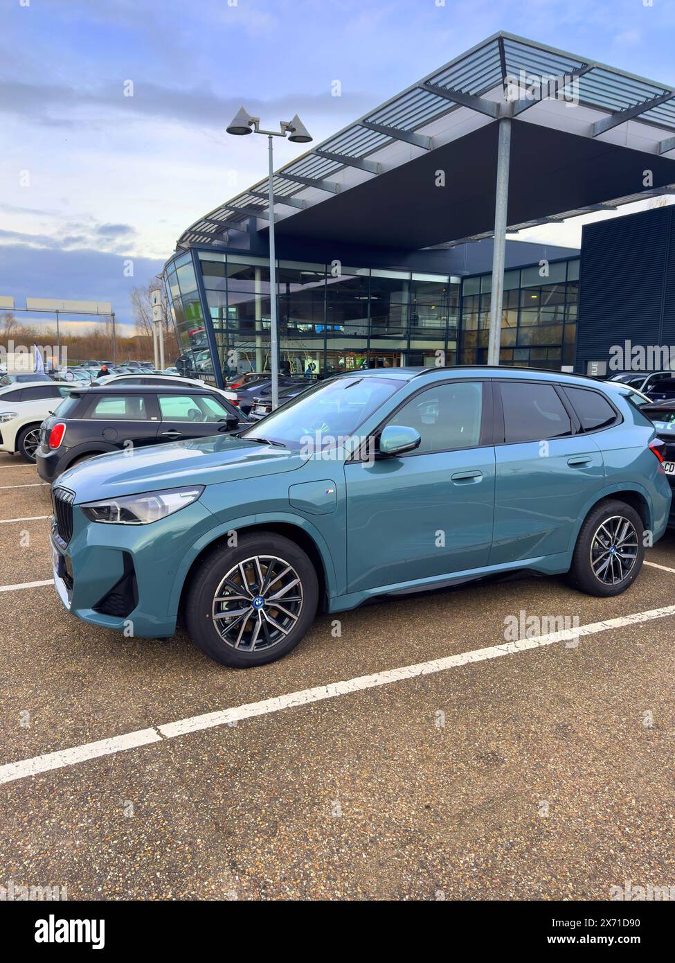 Paris, France - Mar 1, 2024: A blue BMW SUV is showcased in the parking ...