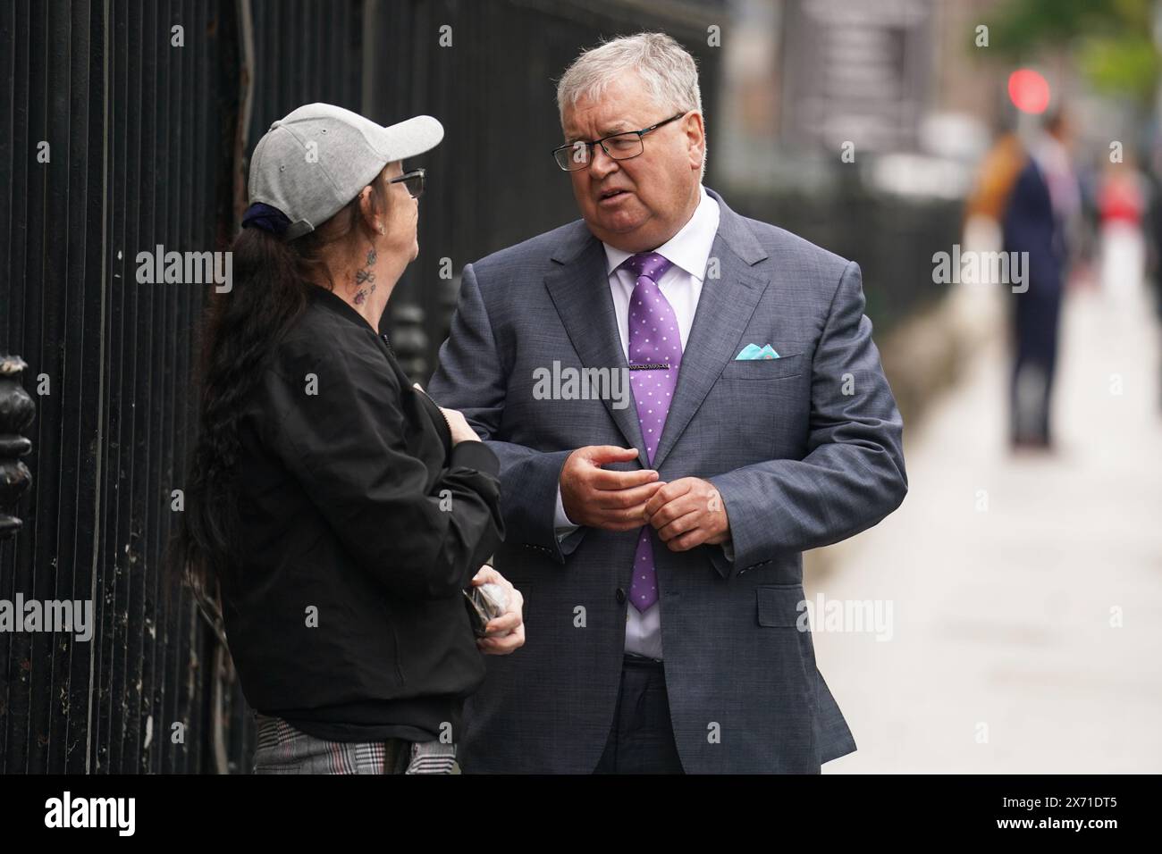 RTE presenter Joe Duffy speaks to Cathy Ellis as they arrive for mass ...