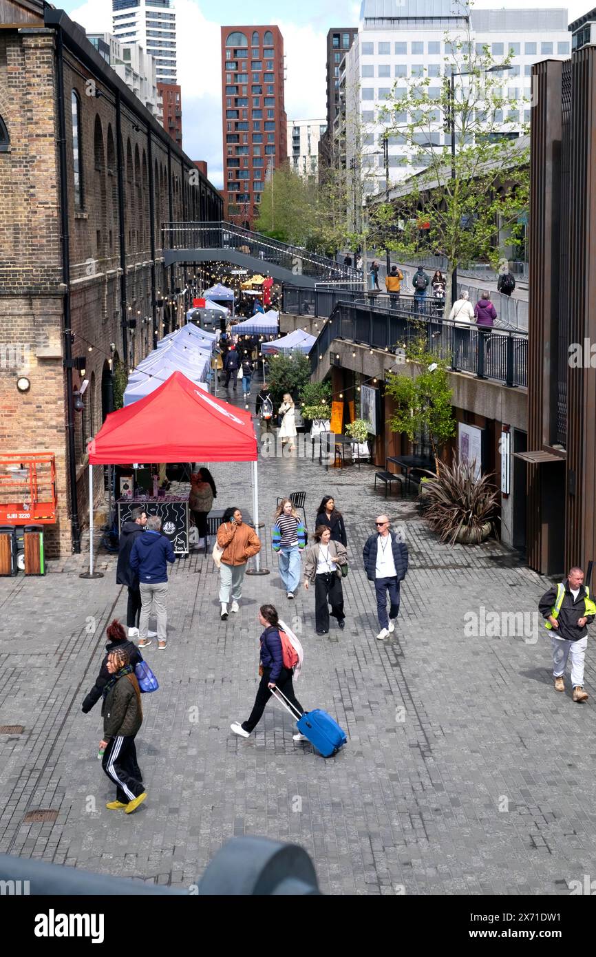 People walking on Lower Stable Street at Coal Drops Yard shopping area ...