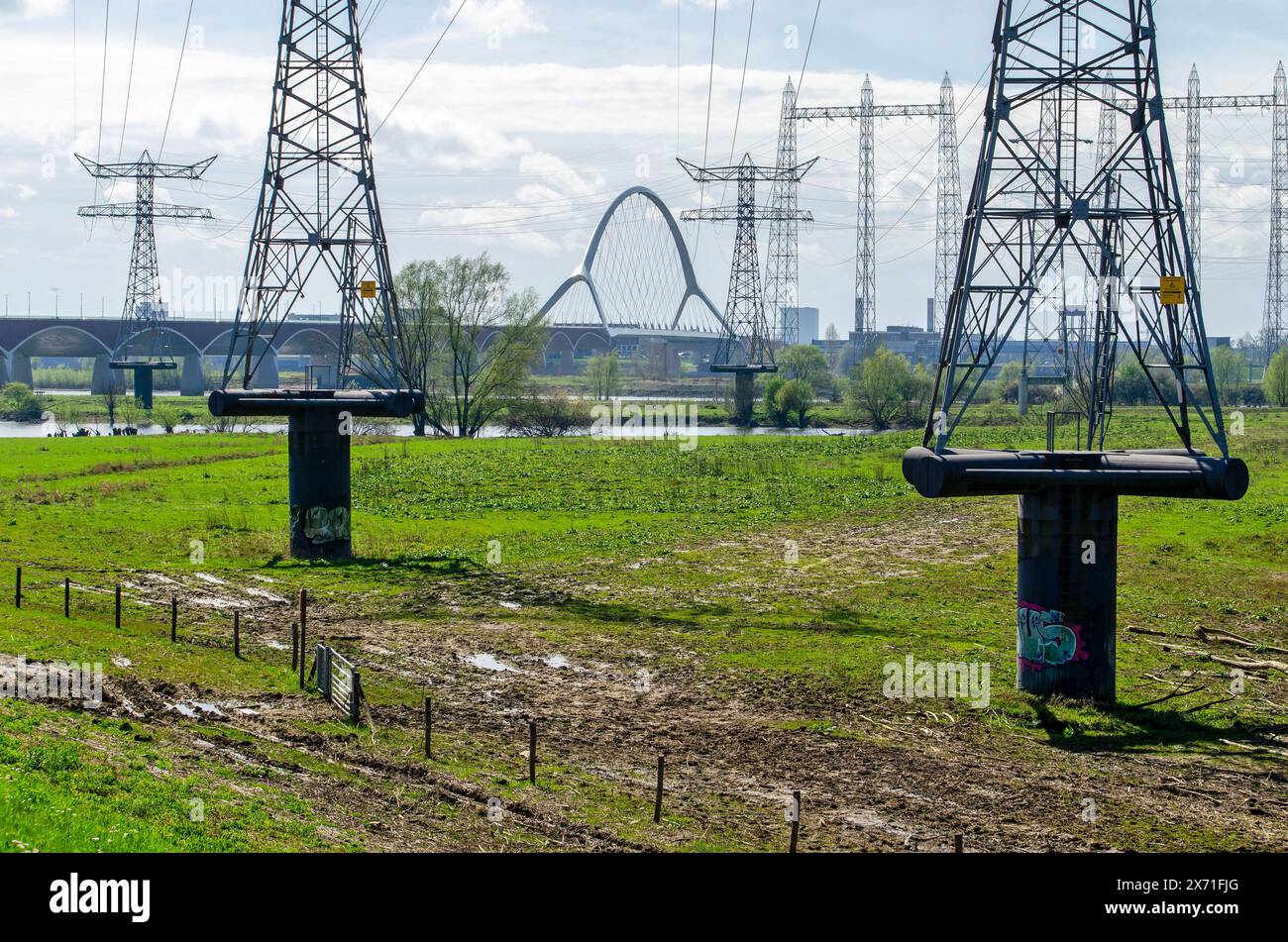 Two high voltage pylons made of steel, placed on concrete stilts for ...