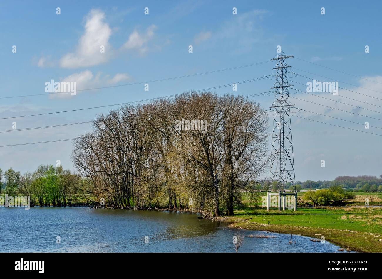 Steel construction of an electricity pylon, plaed on a concrete stilt ...