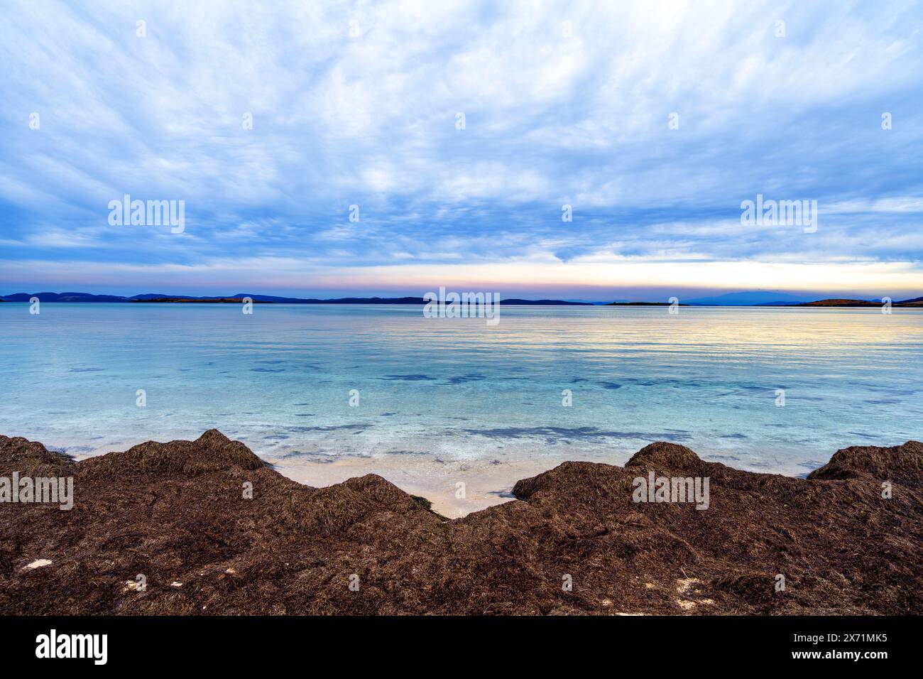 Early morning with calm reflective water at Dunalley Beach, South ...