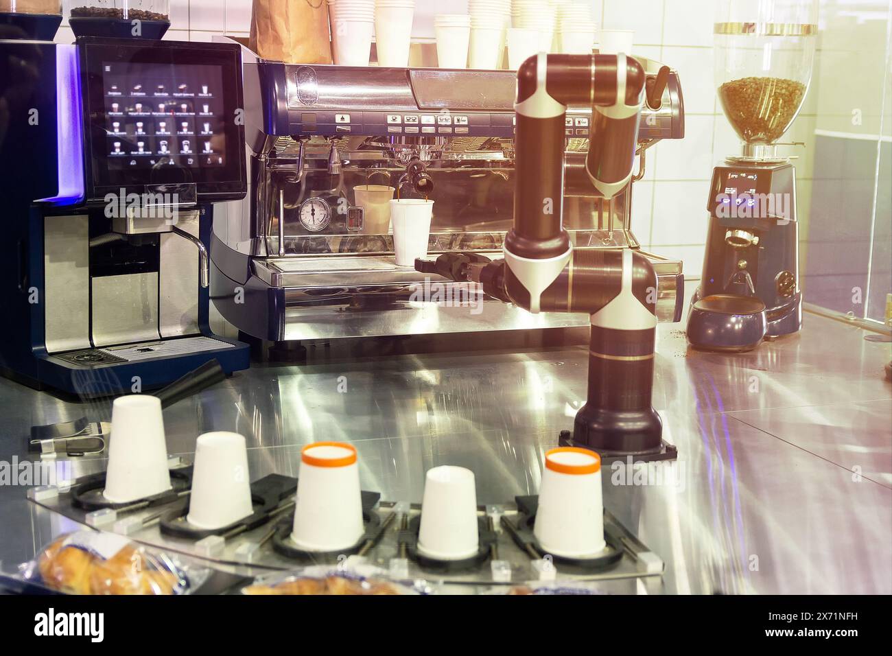 Robot with artificial intelligence making coffee on coffee machine ...