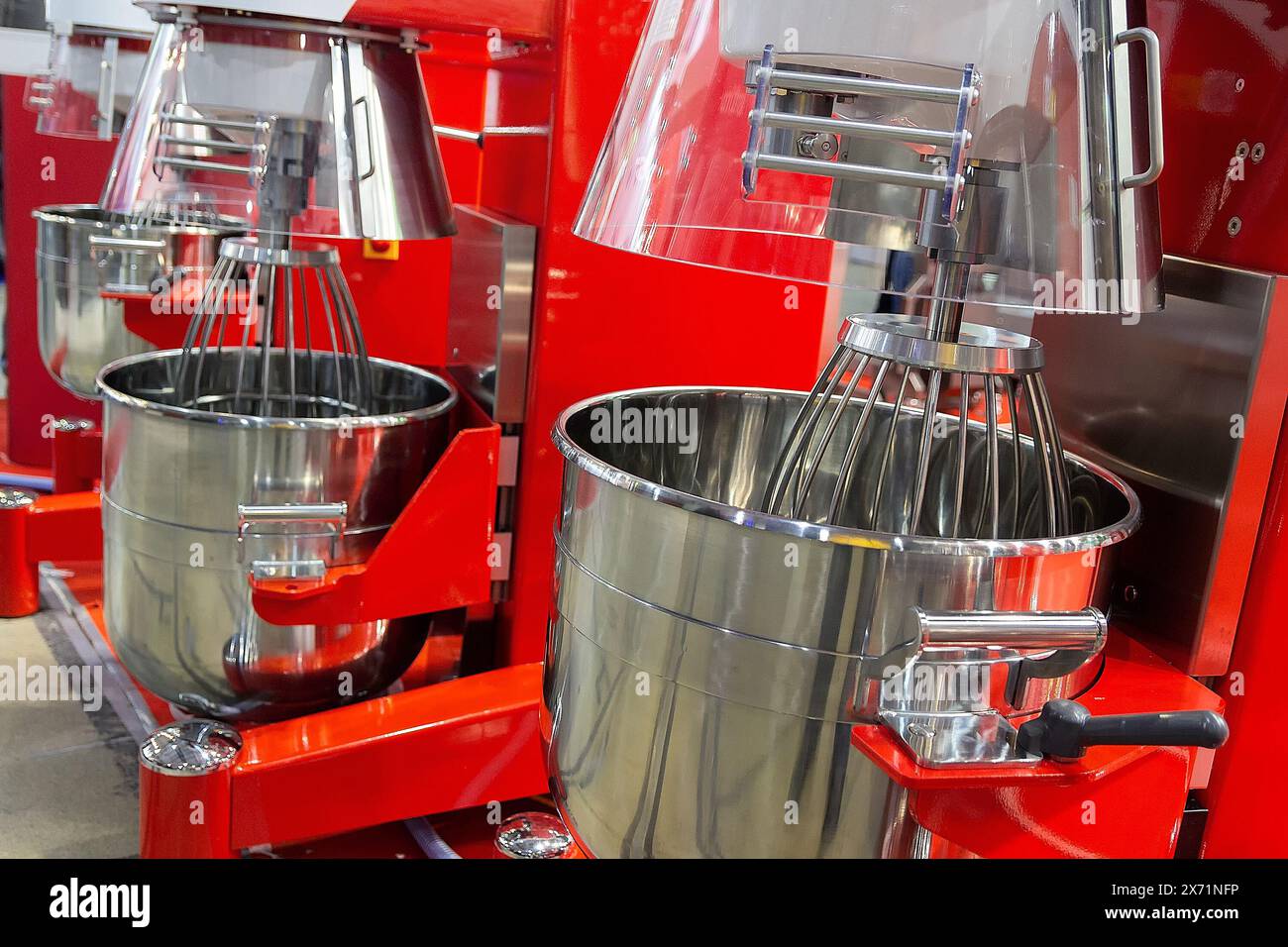 Modern industrial mixers at the stand in the exhibition hall. Food ...