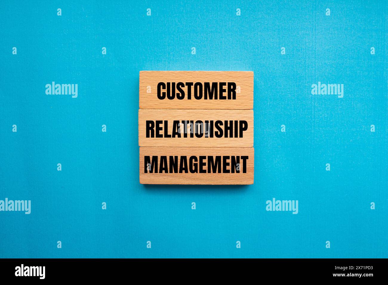 Customer relationship management words written on wooden blocks with ...