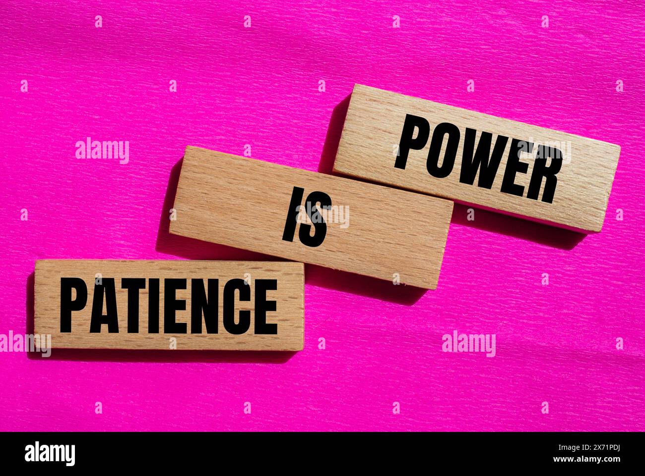 Patience is power words written on wooden blocks with pink background ...