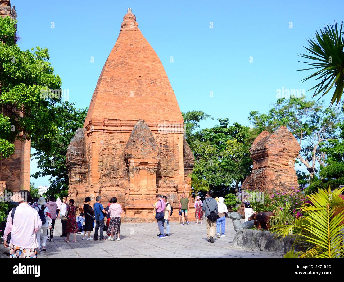 Tourists and visitors explore Po Nagar, a Cham temple tower founded ...