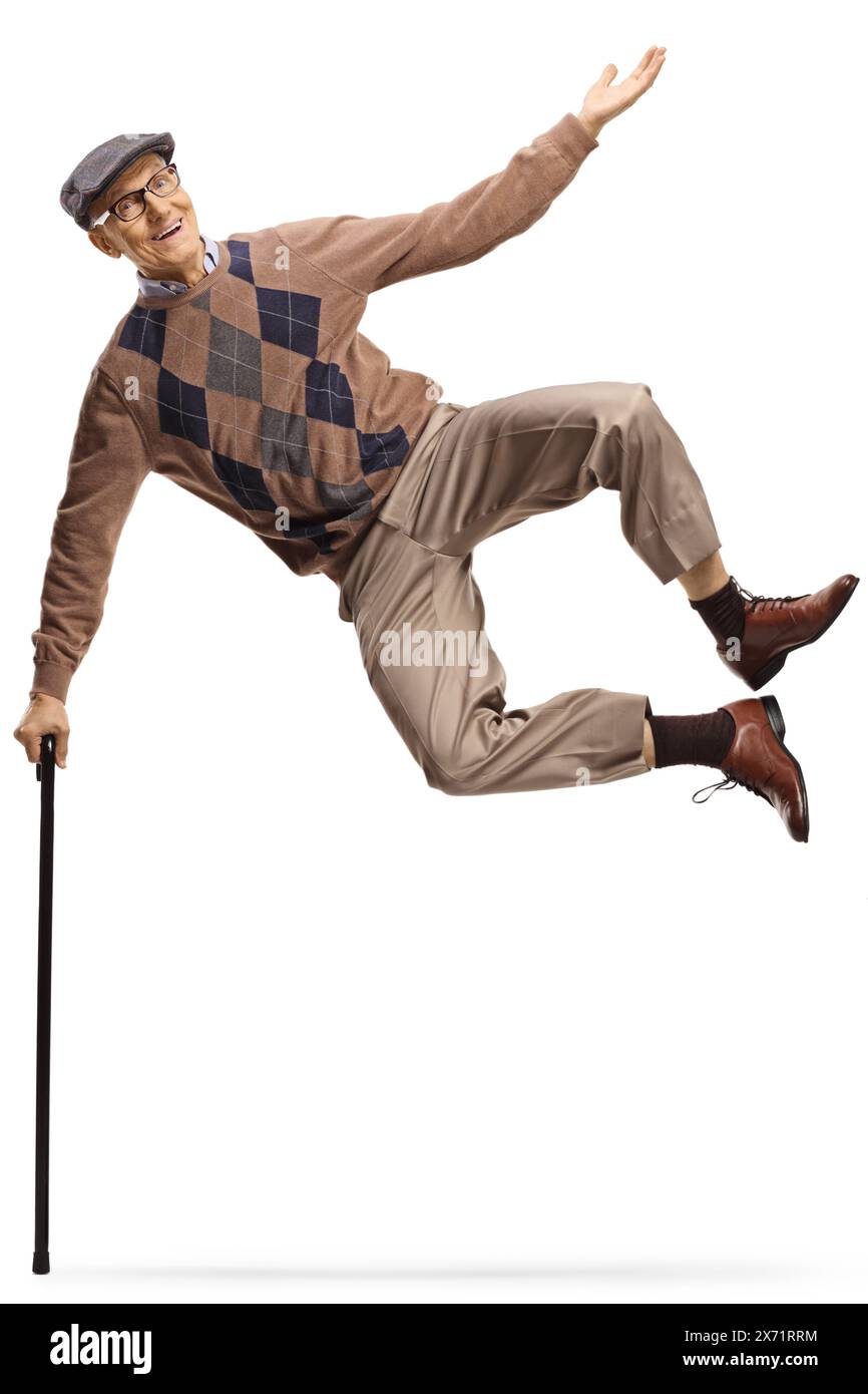 Healthy elderly man leaning on a walking cane and jumping isolated on ...