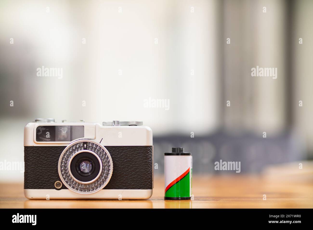 vintage style film camera sits on table in office It's film camera that ...