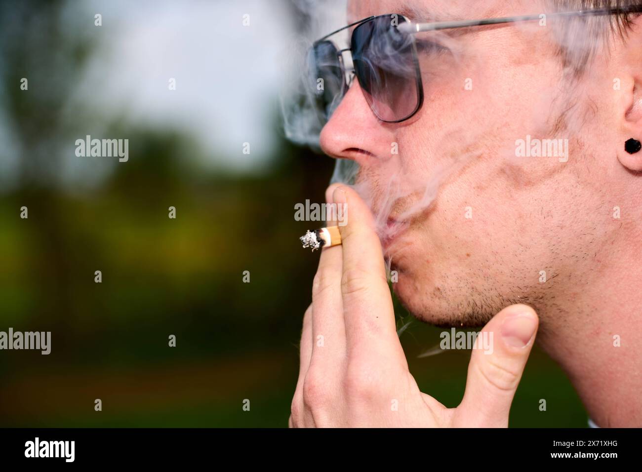 Puffs smoke from cigarette on hi-res stock photography and images - Alamy