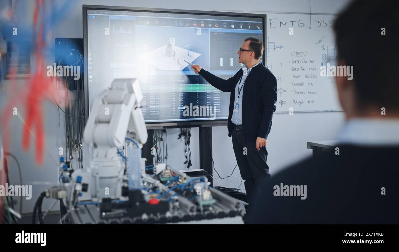 Male Professor Showing at the Big Screen During the Lesson. Diverse ...