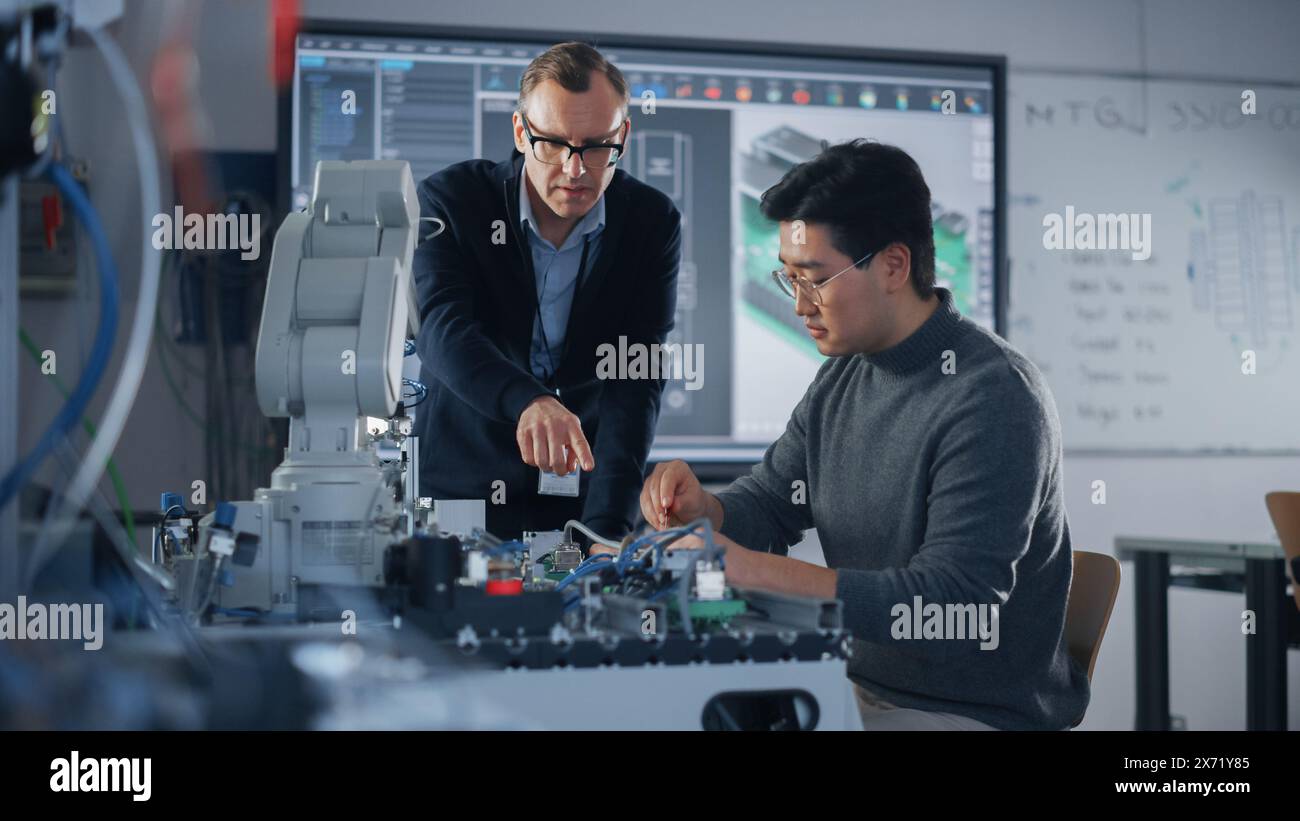 Chief Engineer Helping Asian Student of Engineering Faculty Work With ...