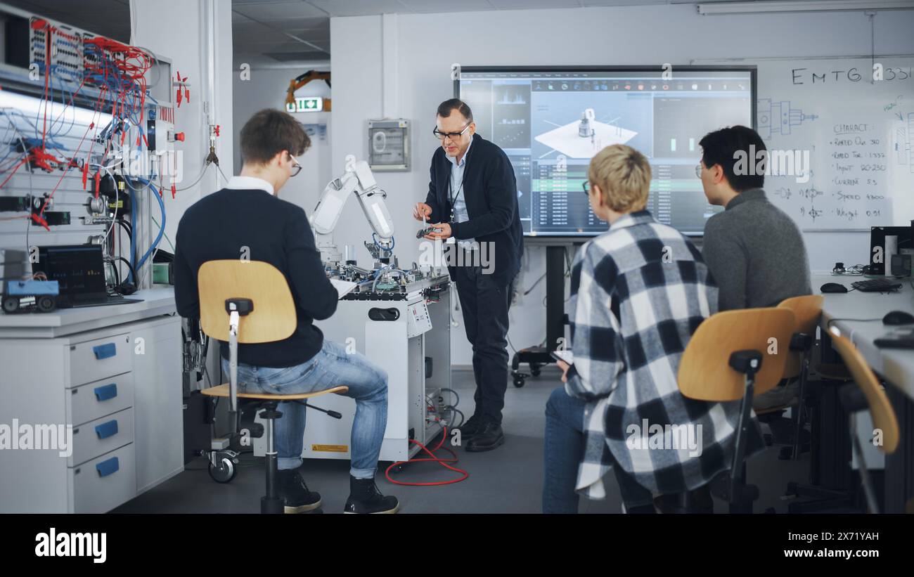 University Robotics Class. White Male Teacher Explaining Engineering to ...