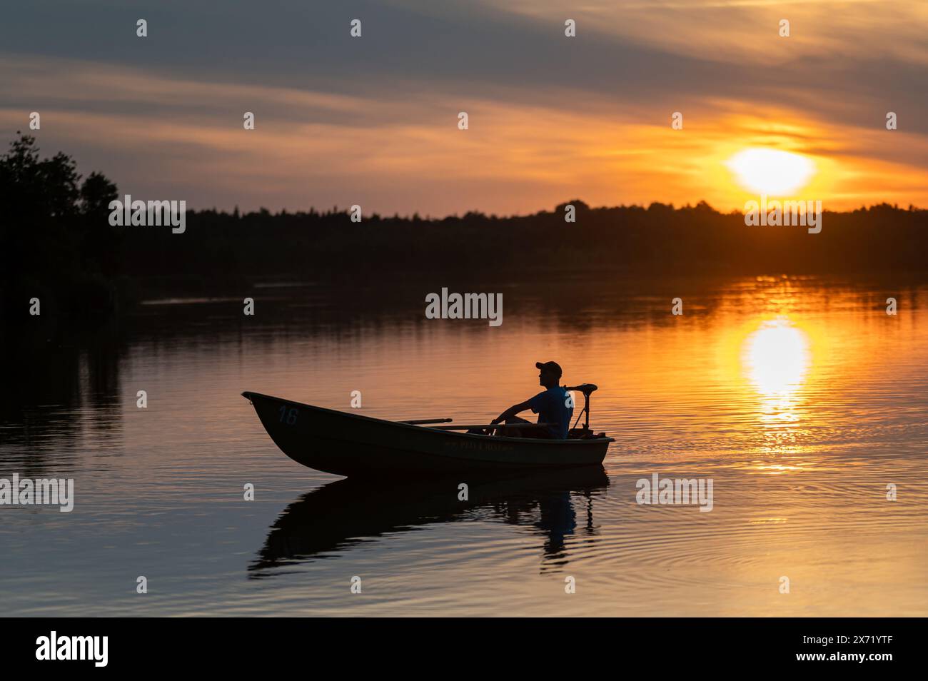 Man rows boat during hi-res stock photography and images - Alamy