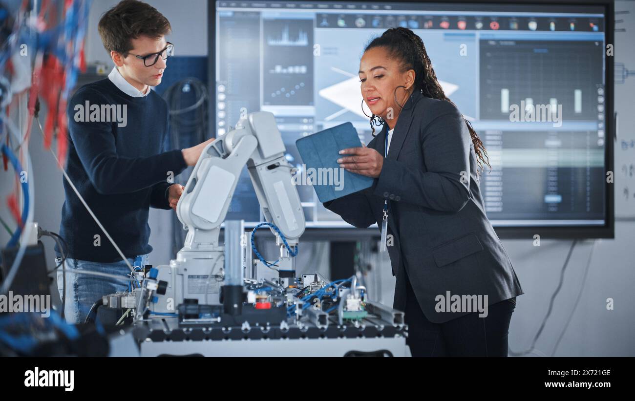 Black Female Chief Engineer Holding Tablet and Talking with Male ...