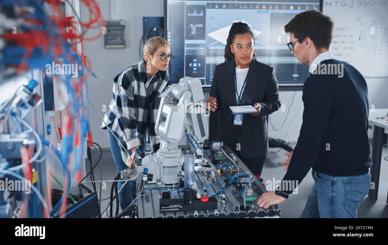 In Robotics Development Laboratory: Black Female Teacher and Two ...