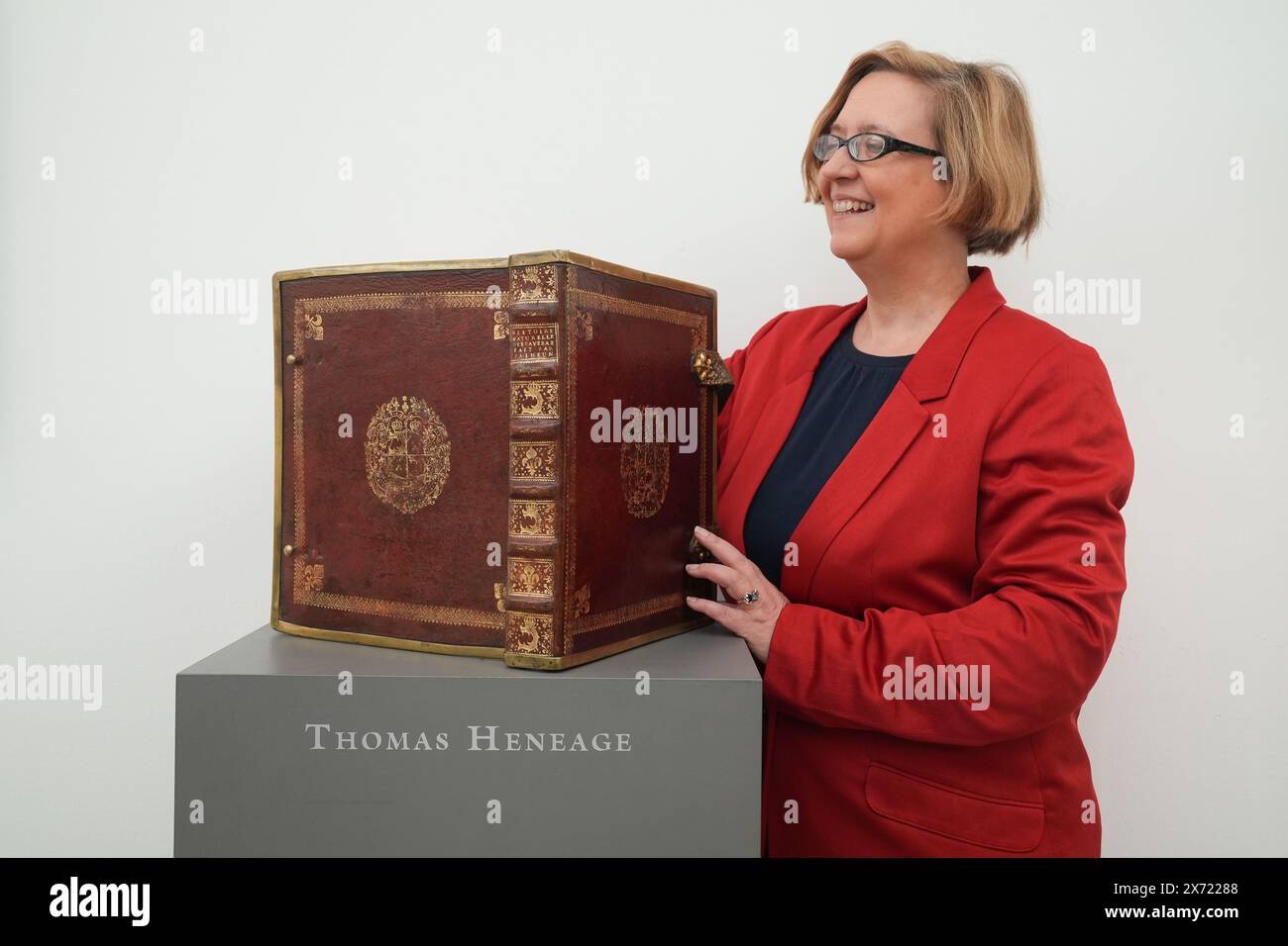 A staff member with 'A French Royal metamorphic bookbinding made for ...