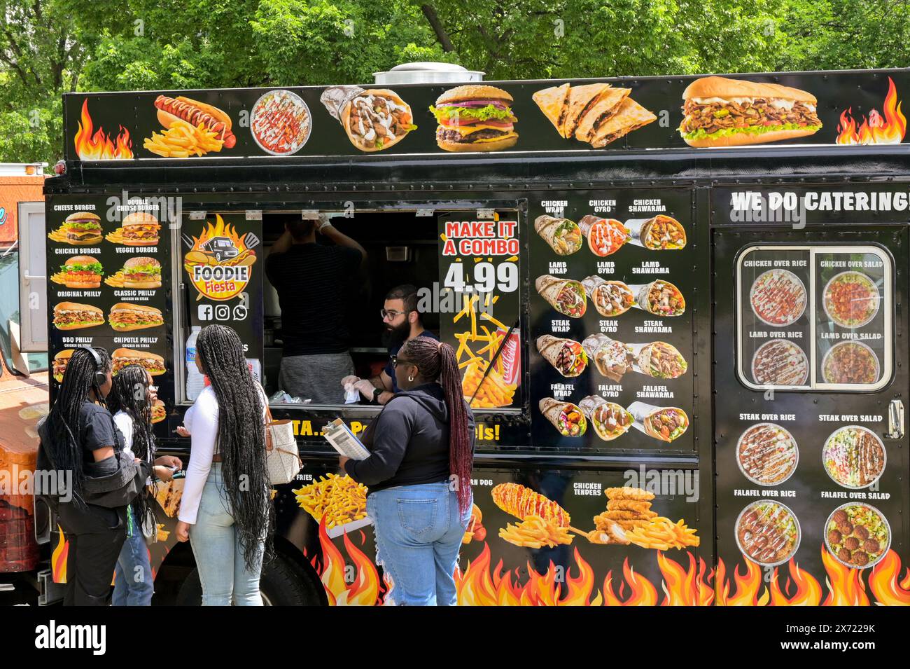 Washington DC, USA - 3 May 2024: People buying fast food from a mobile ...