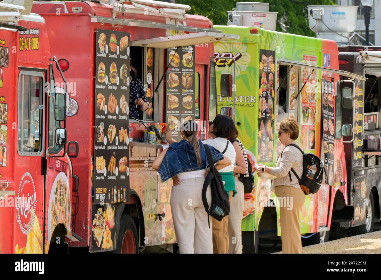Washington DC, USA - 3 May 2024: People buying fast food from a mobile ...