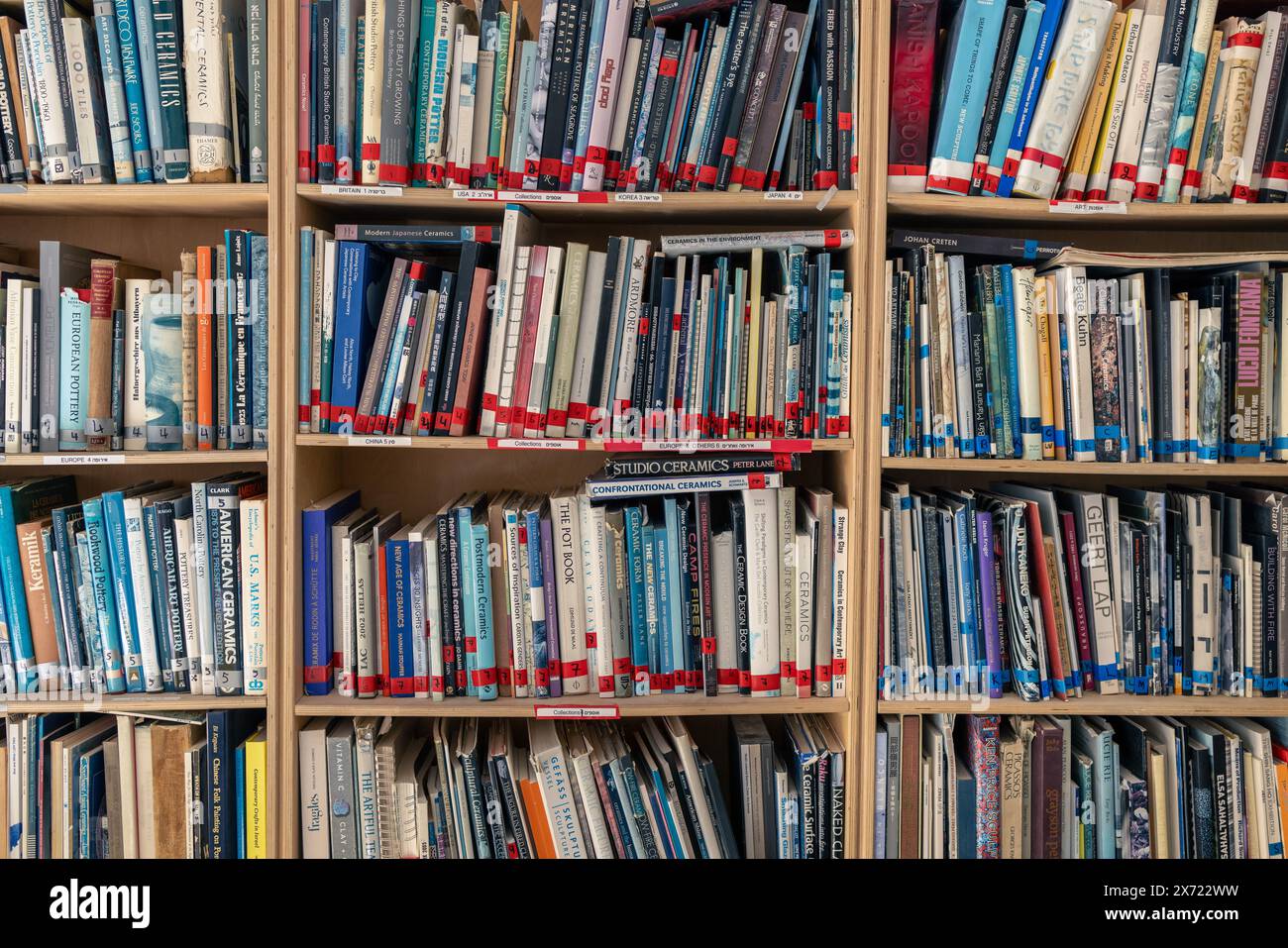 Collection of books organized on shelves in a library Stock Photo - Alamy