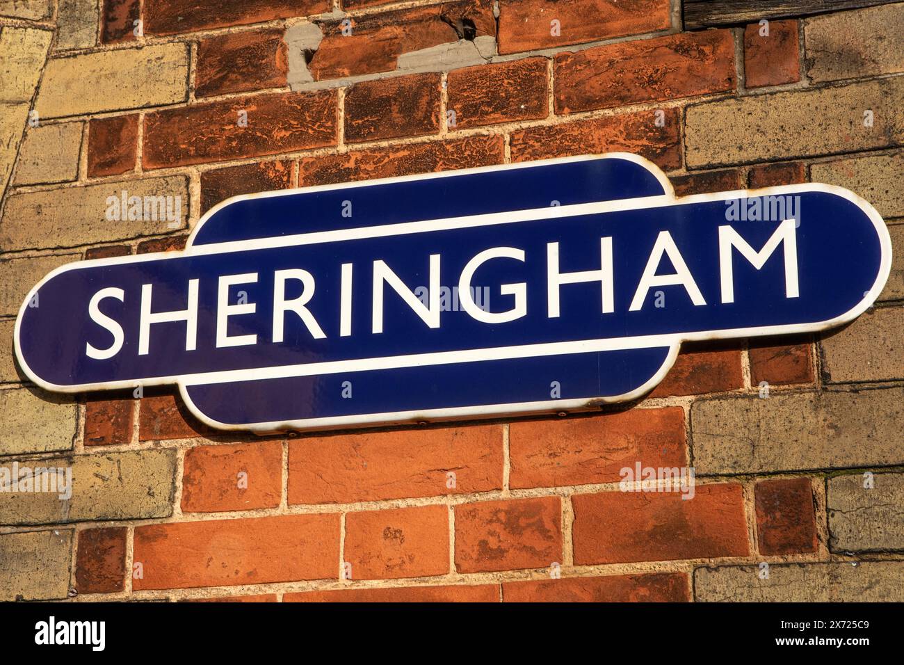 Close-up of the Sheringham sign on the platform of Sheringham Railway ...