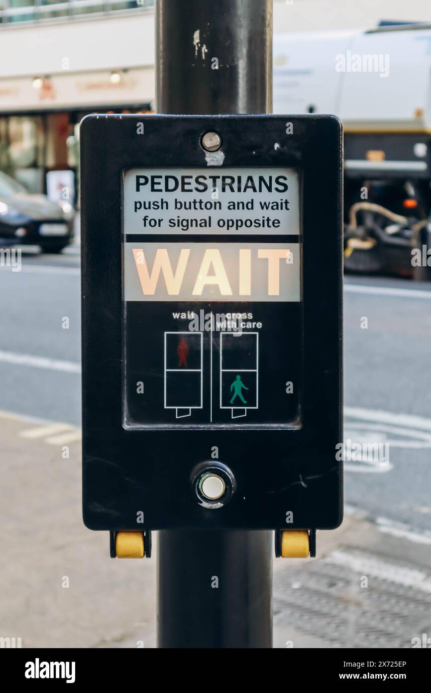 Pedestrian Crossing button in London City Centre Stock Photo - Alamy