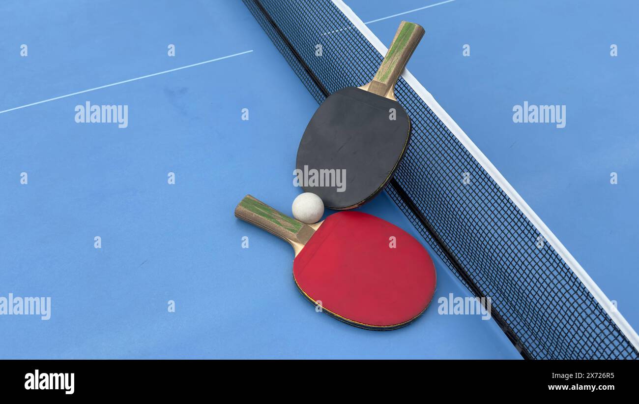 Table tennis rackets and ball on tennis table Stock Photo - Alamy