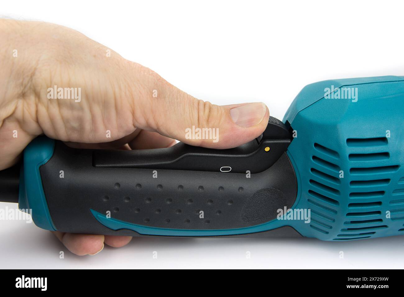 Angle grinder switch trigger with a safety lock Stock Photo - Alamy