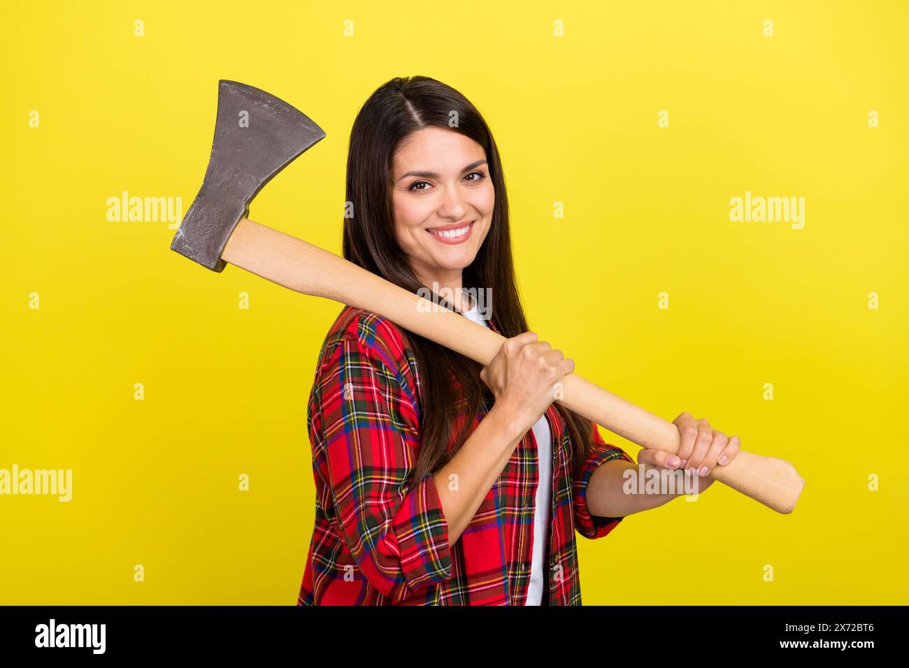 Photo of strong funny lady dressed checkered shirt holding sharp axe ...