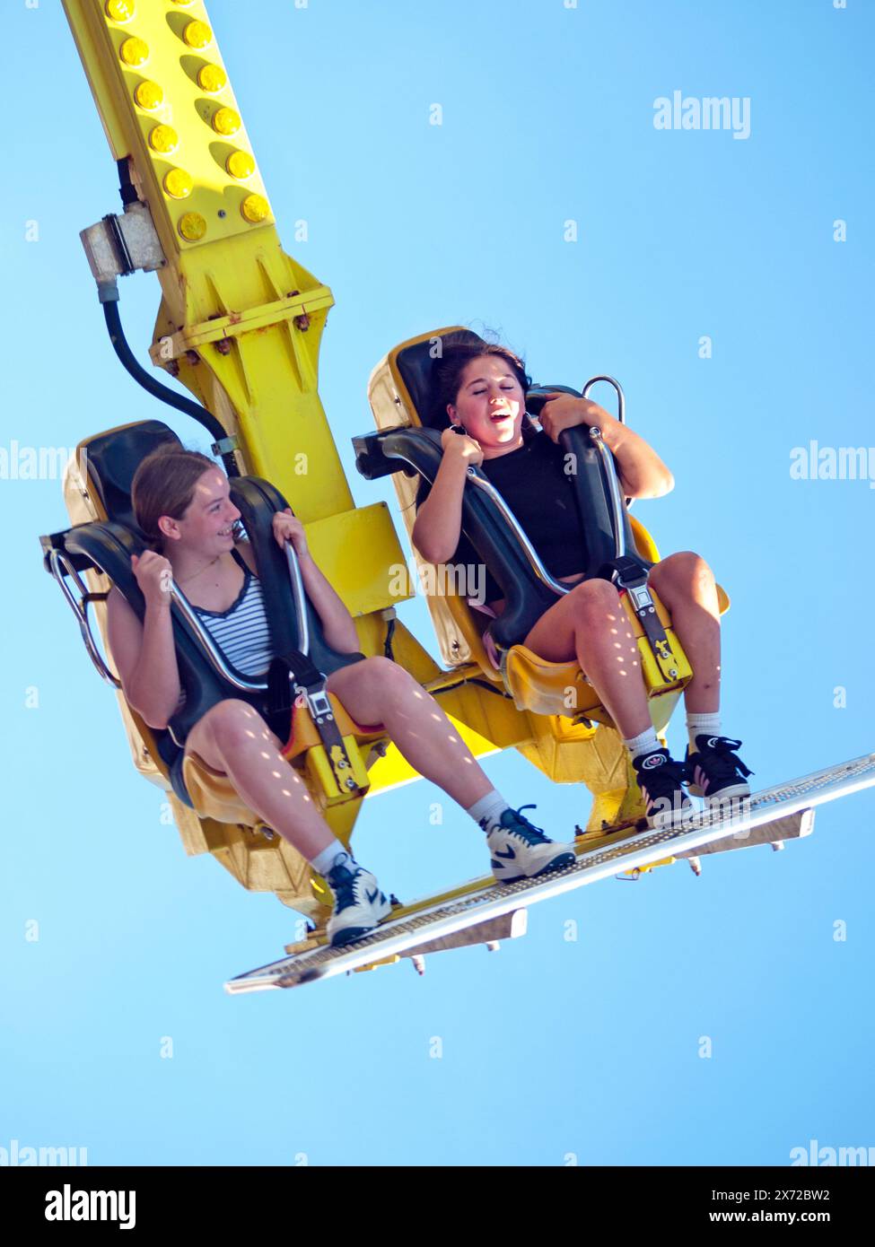 Fun on an amusement ride on Brighton Pier Stock Photo - Alamy