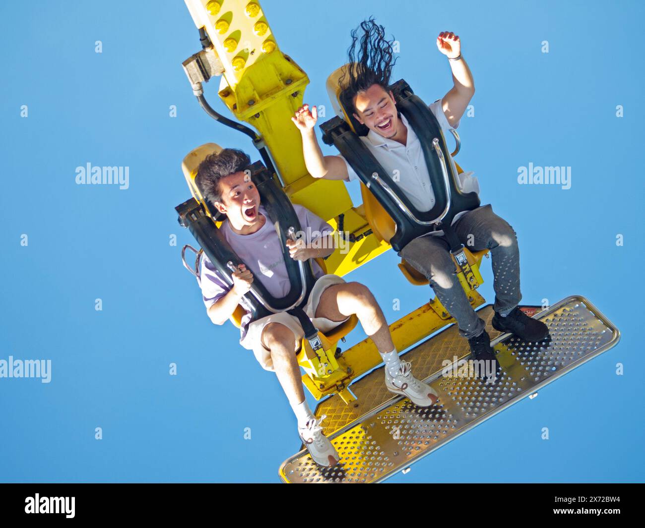 Fun on an amusement ride on Brighton Pier Stock Photo - Alamy