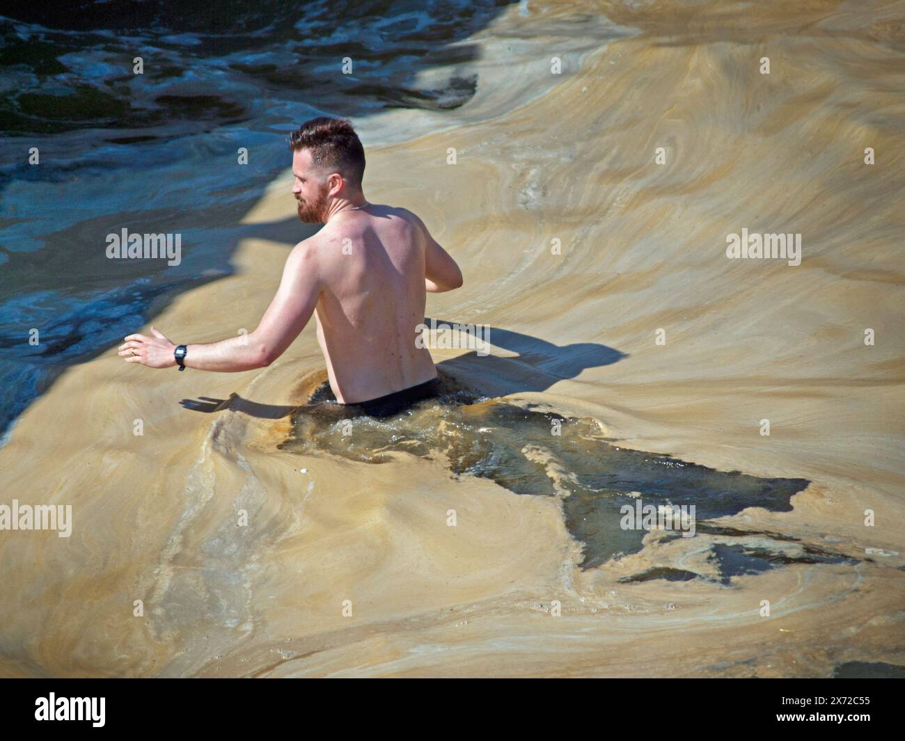 Man wading through the sea hi-res stock photography and images - Alamy