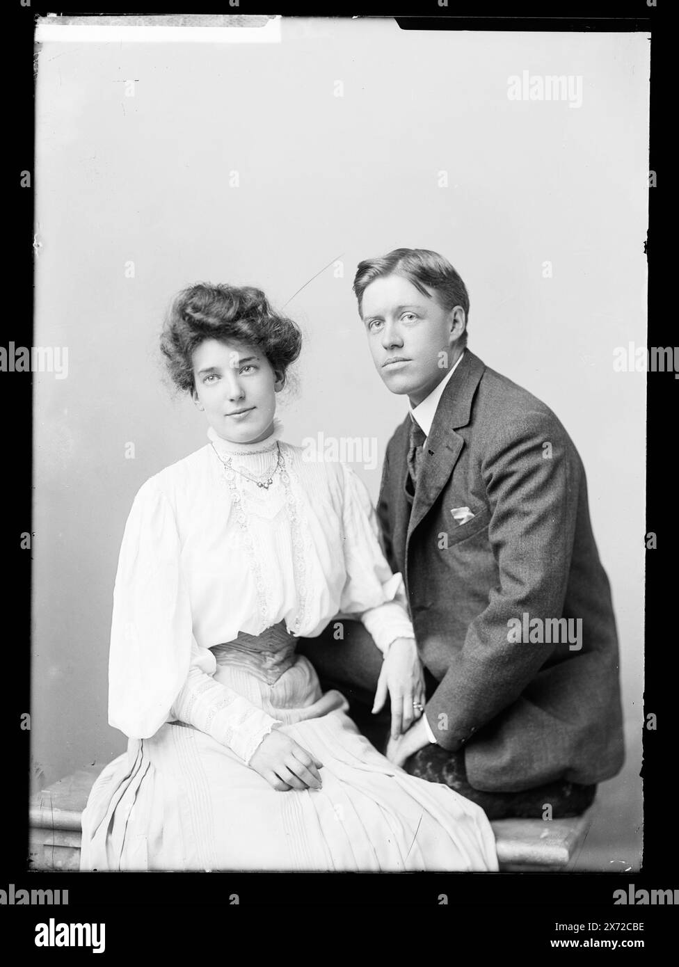 Clarence S. Jackson and wife, seated, three-quarter-length portrait ...